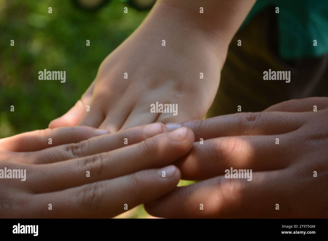 Children hands together hi-res stock photography and images - Alamy