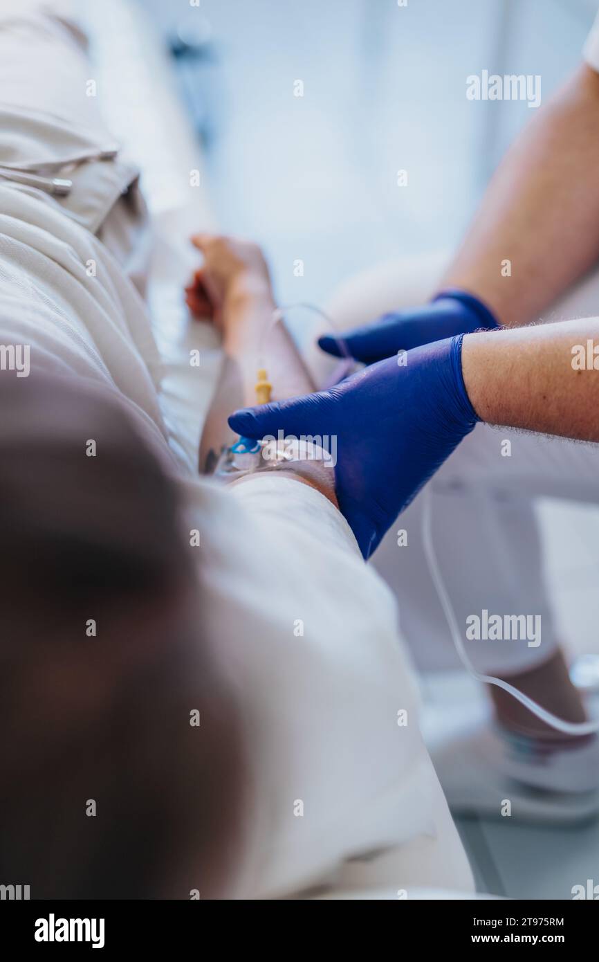 Experienced doctor providing medical care, checking patient's condition ...