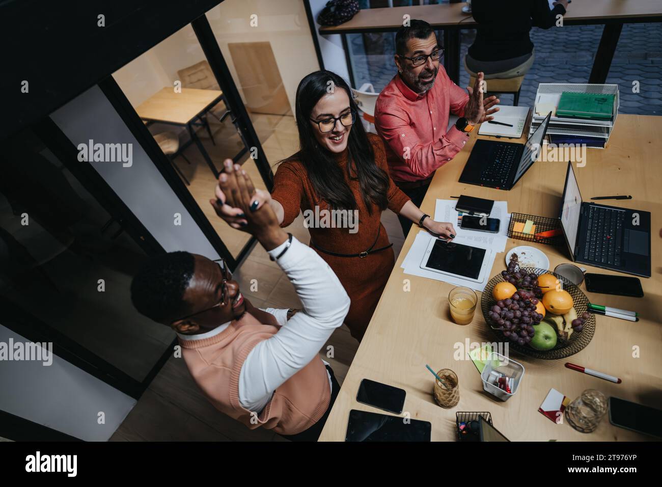Business team working late into the night to meet project deadlines ...
