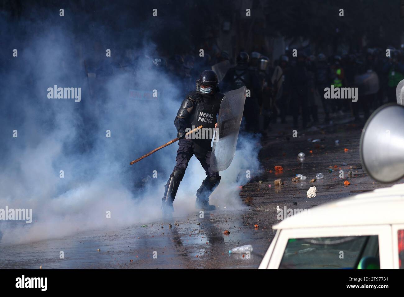 Kathmandu, NE, Nepal. 23rd Nov, 2023. A Nepali police officer tries to ...