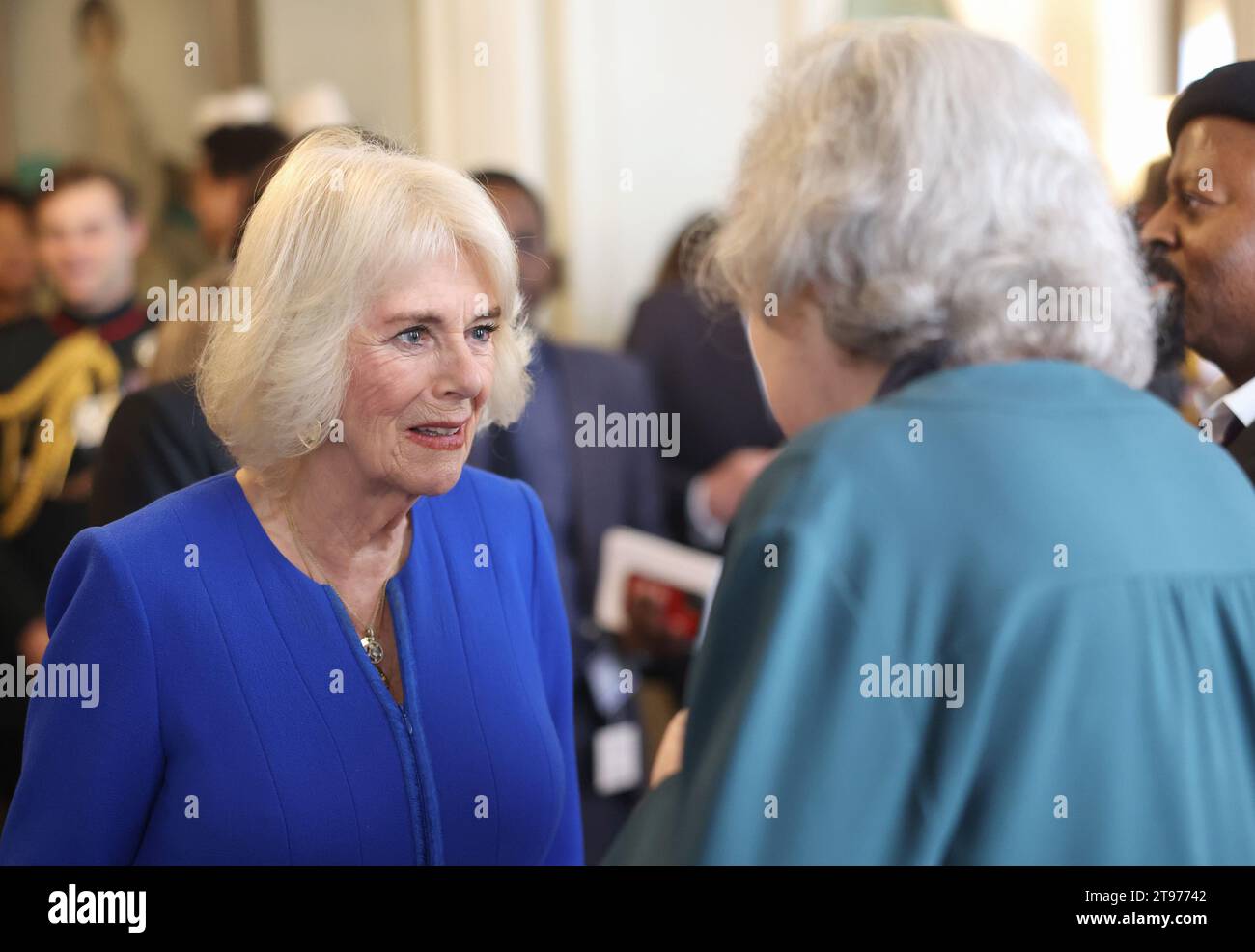 Queen Camilla speaks to guests during a reception at Clarence House, London, for the Booker ...