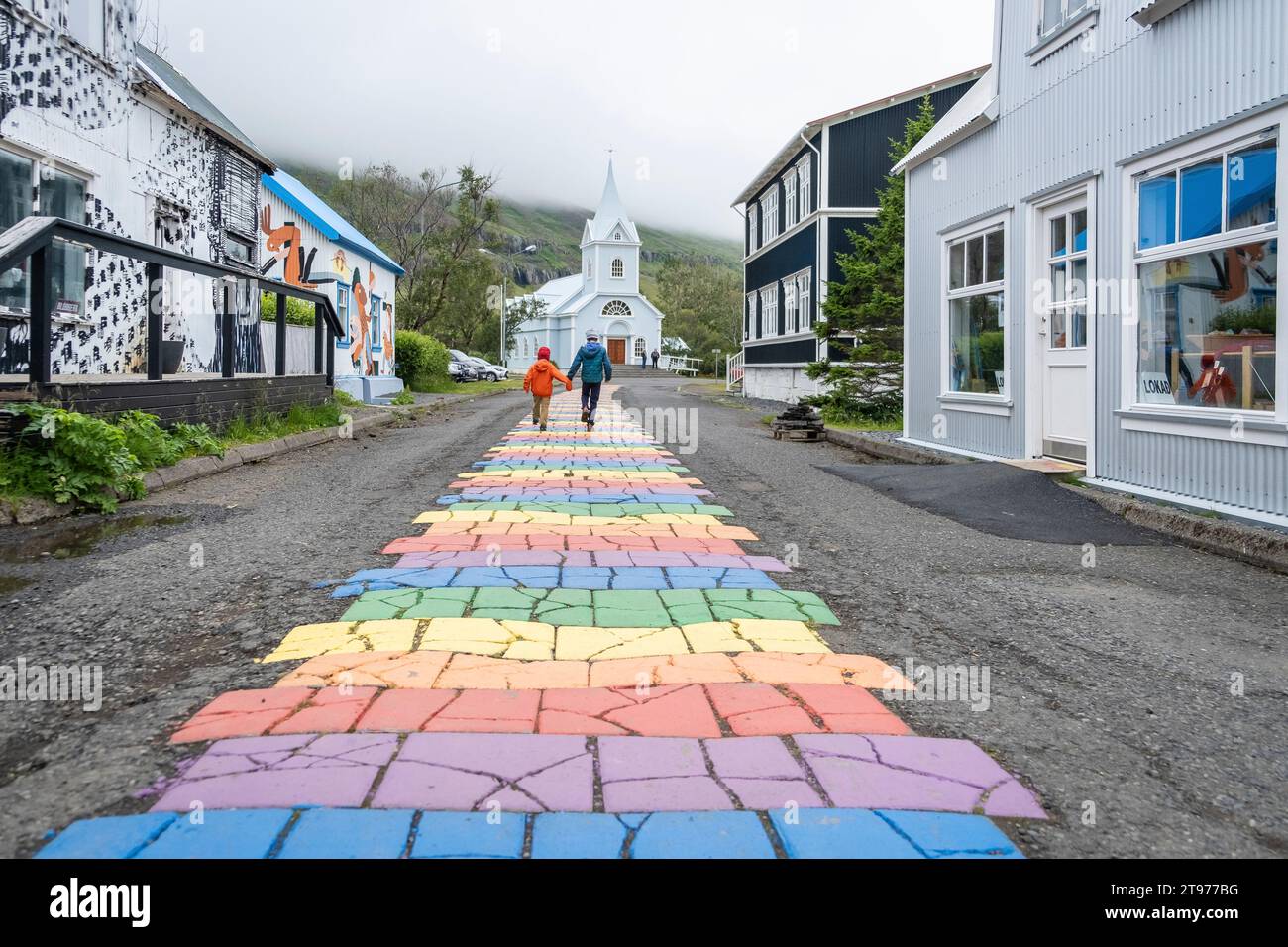 Rainbow street (pathway) through the village of Seydisfjordur, Iceland ...