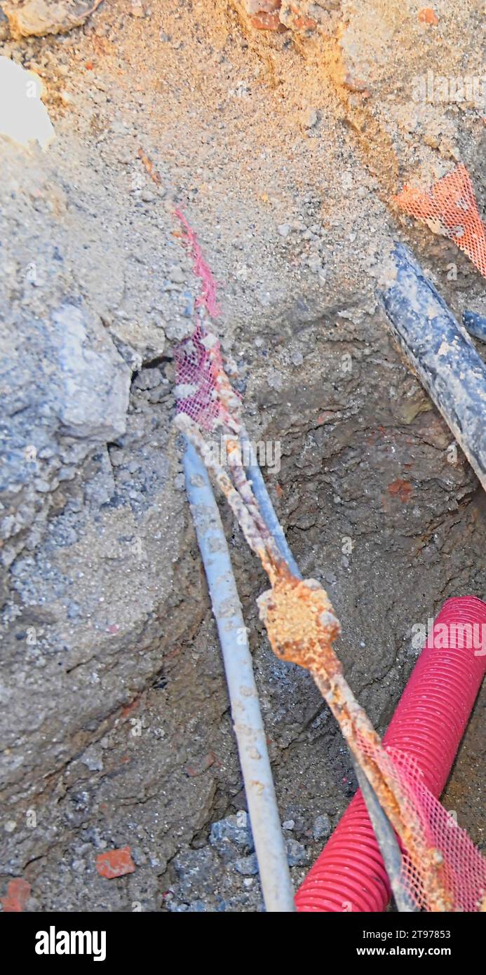 Cables in the trench. High voltage cables in protective red cover in ...