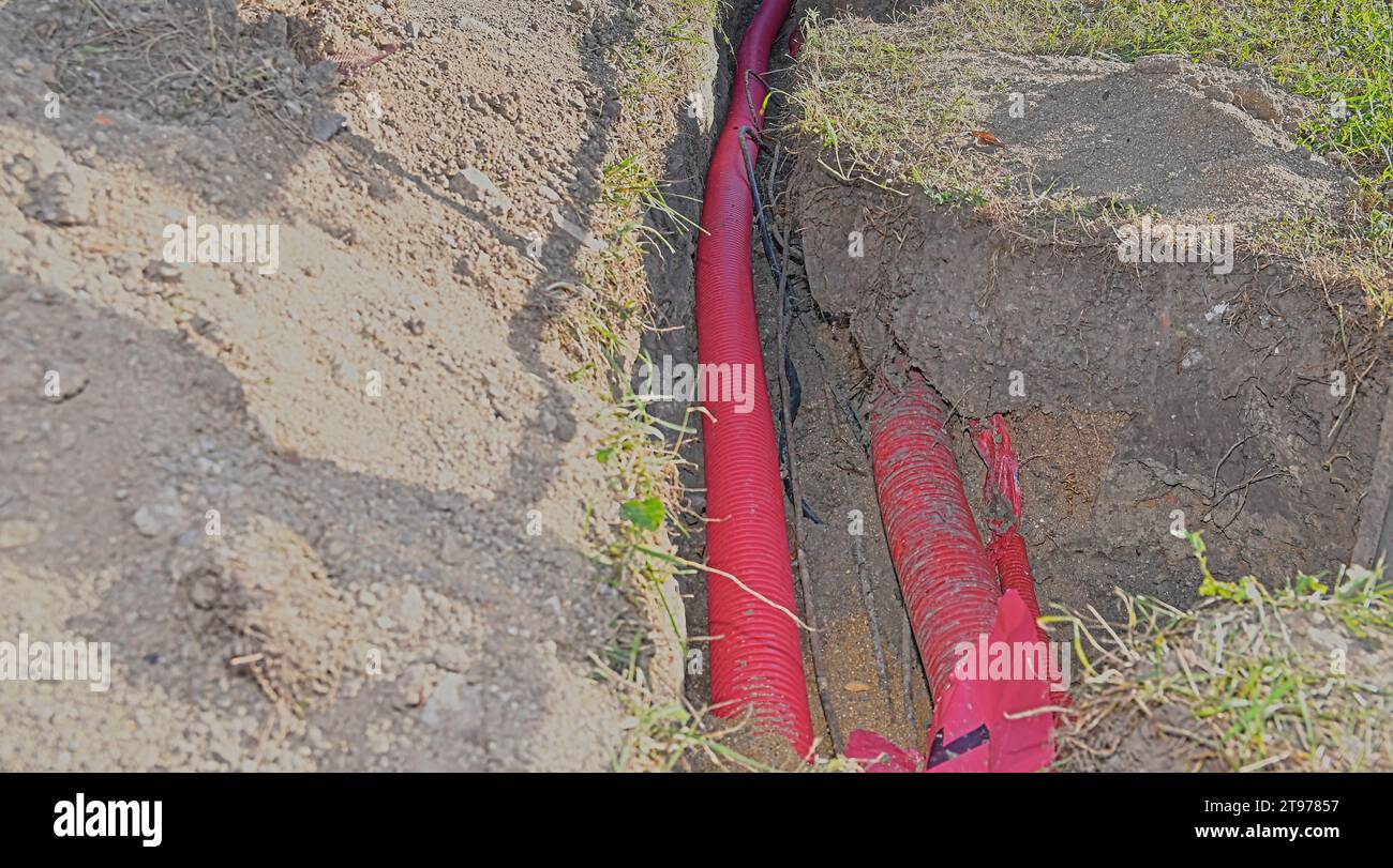 Cables in the trench. High-voltage cables in a protective covering in ...