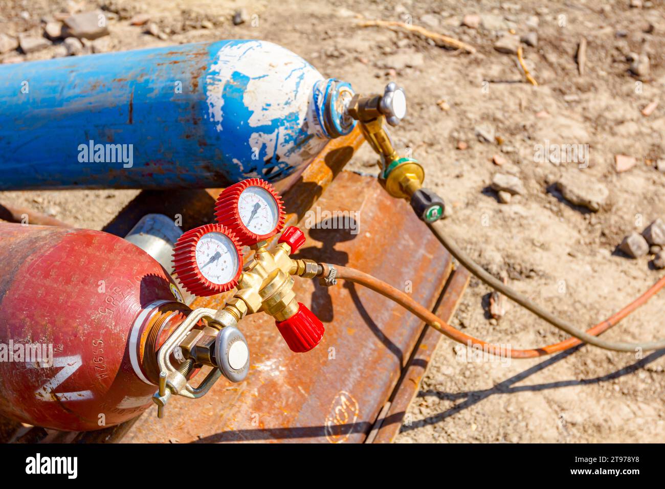 Red and blue welding equipments, oxygen and nitrogen tanks with valves ...