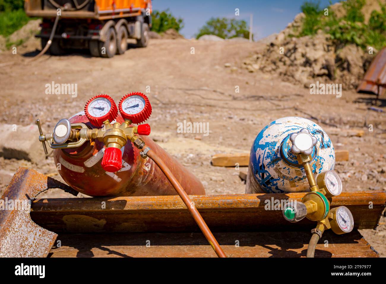 Red and blue welding equipments, oxygen and nitrogen tanks with valves ...