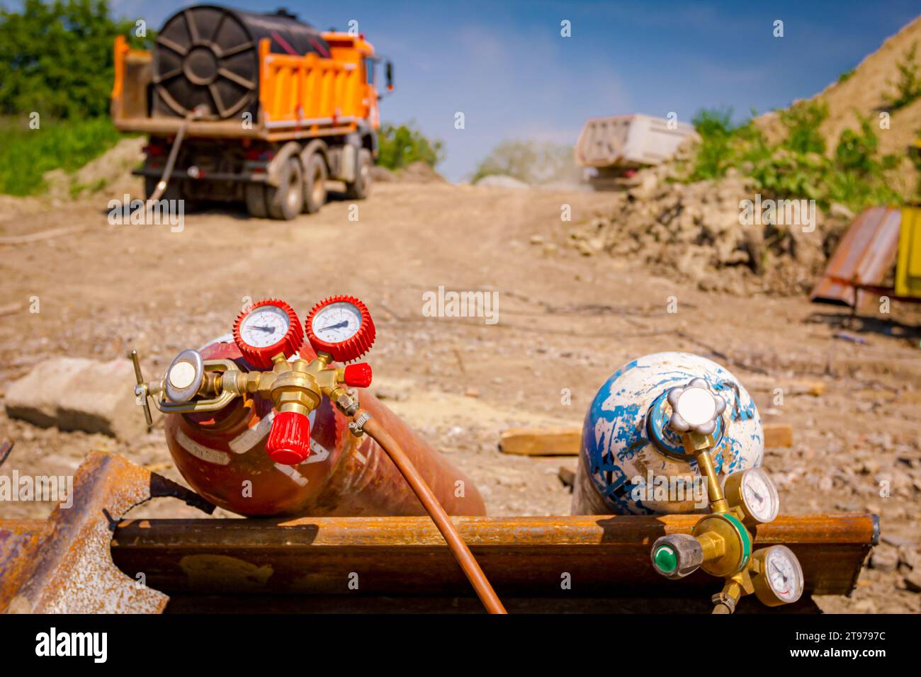 Red and blue welding equipments, oxygen and nitrogen tanks with valves ...