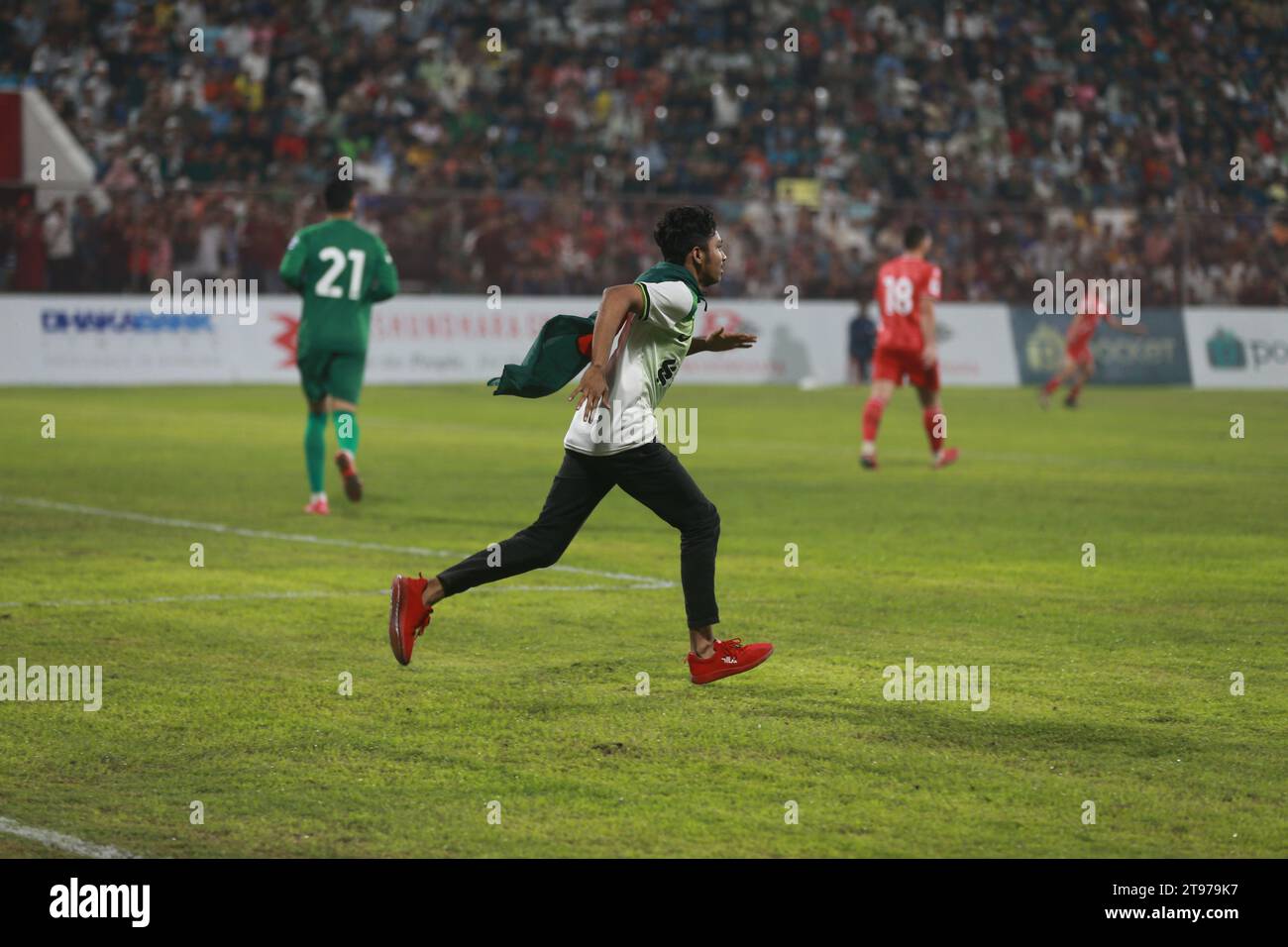 A football fans of gets entry in the pitch during the Bangladesh and ...
