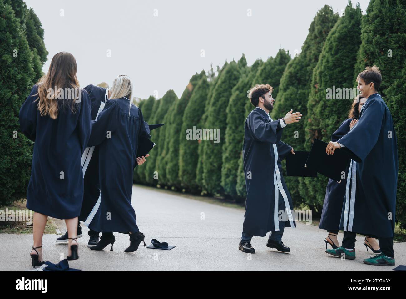 Caps and gowns hang hi-res stock photography and images - Alamy