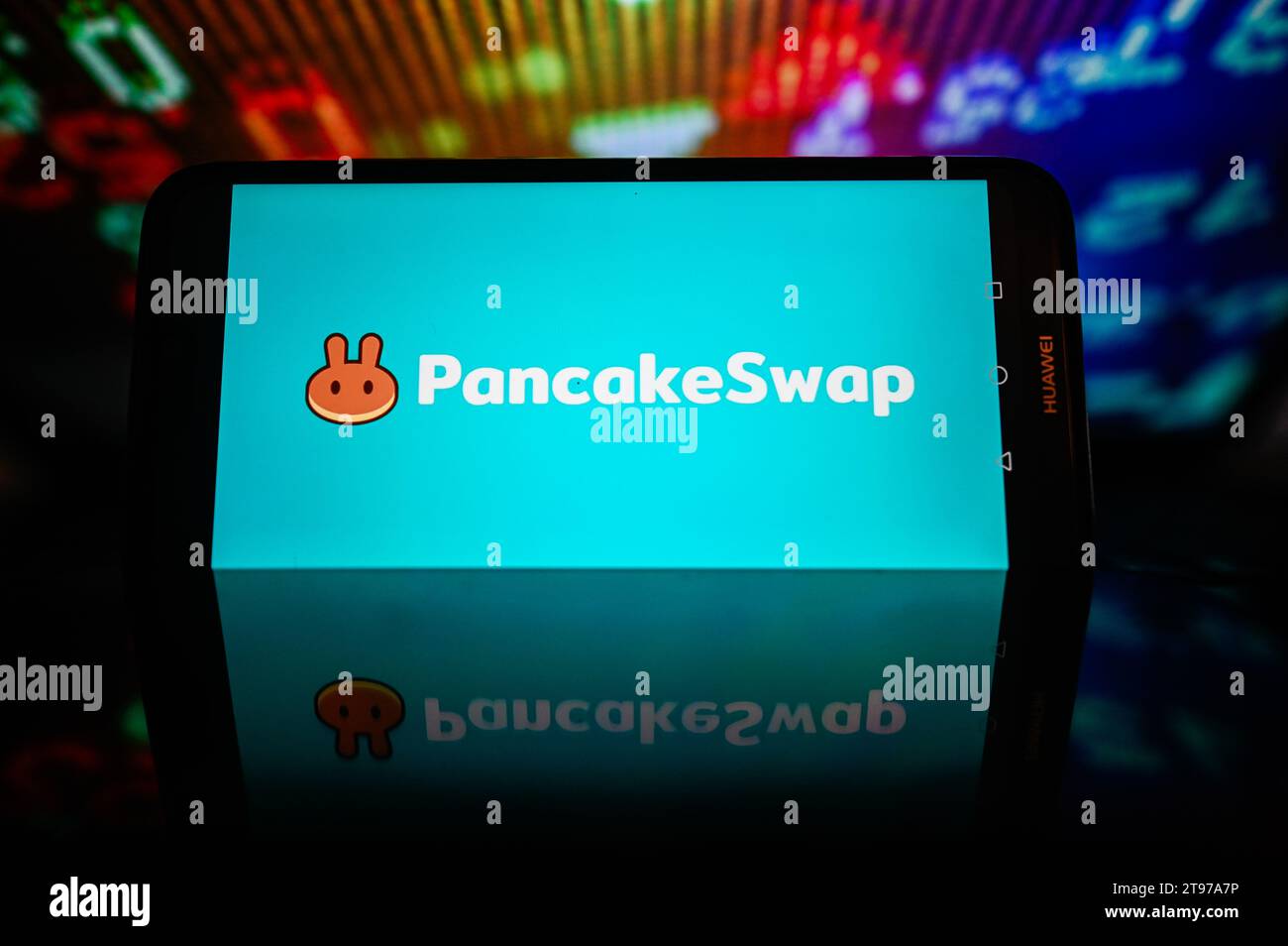 In this photo illustration, a Pancake Swap logo is displayed on a ...
