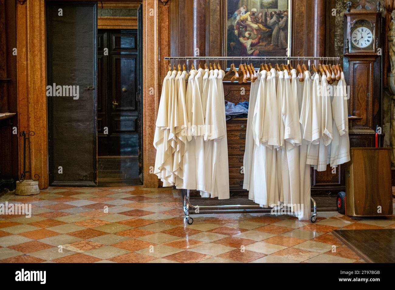 Altar boys' wardrobe inside the church Stock Photo - Alamy