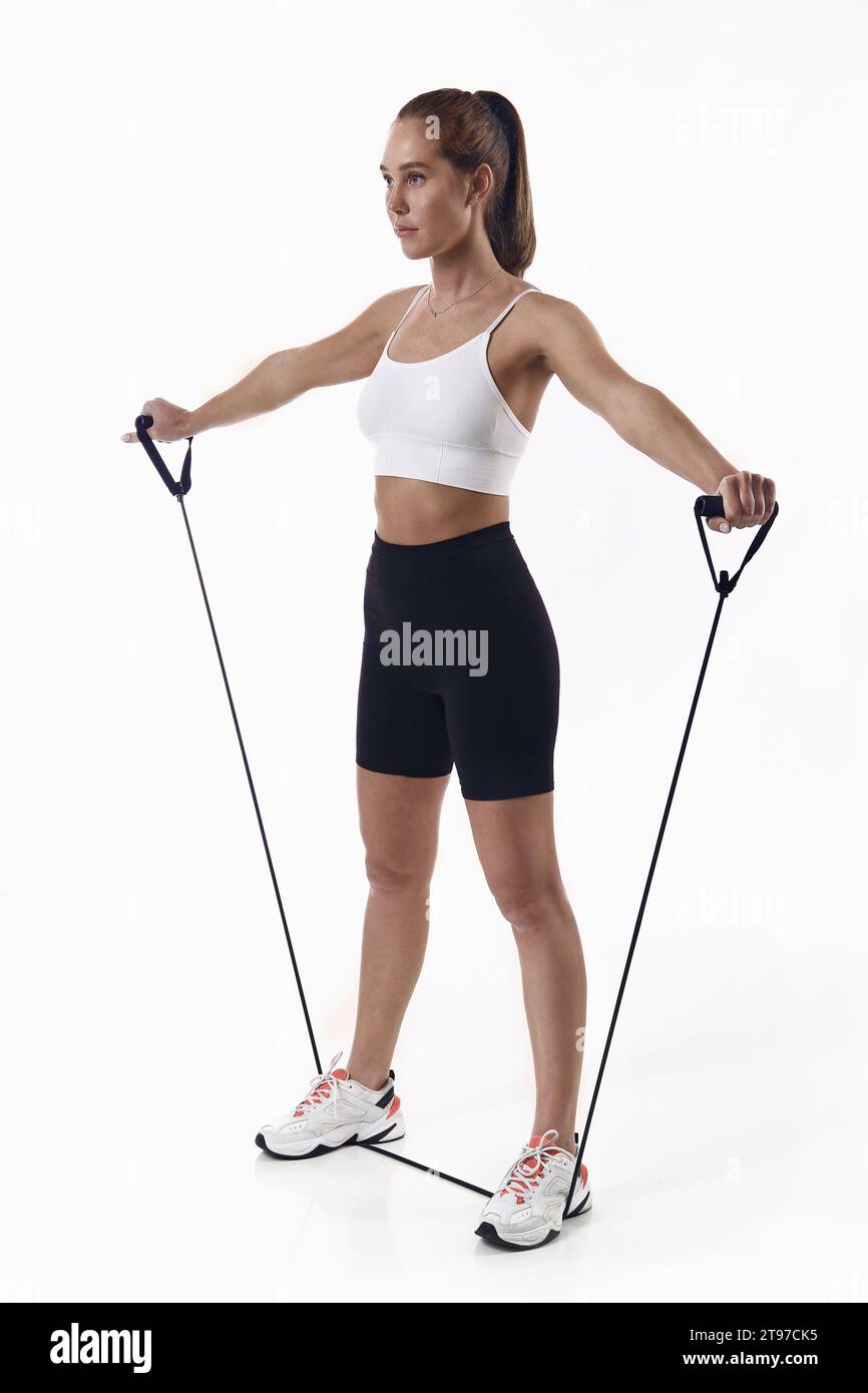 Fitness Exercise. Sports Woman Exercising With Resistance Band ...