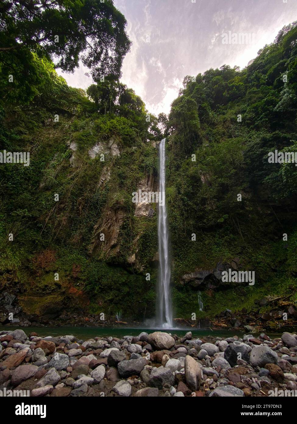 Water cascade in mountainous area in Camiguin Island. Katibawasan Falls ...