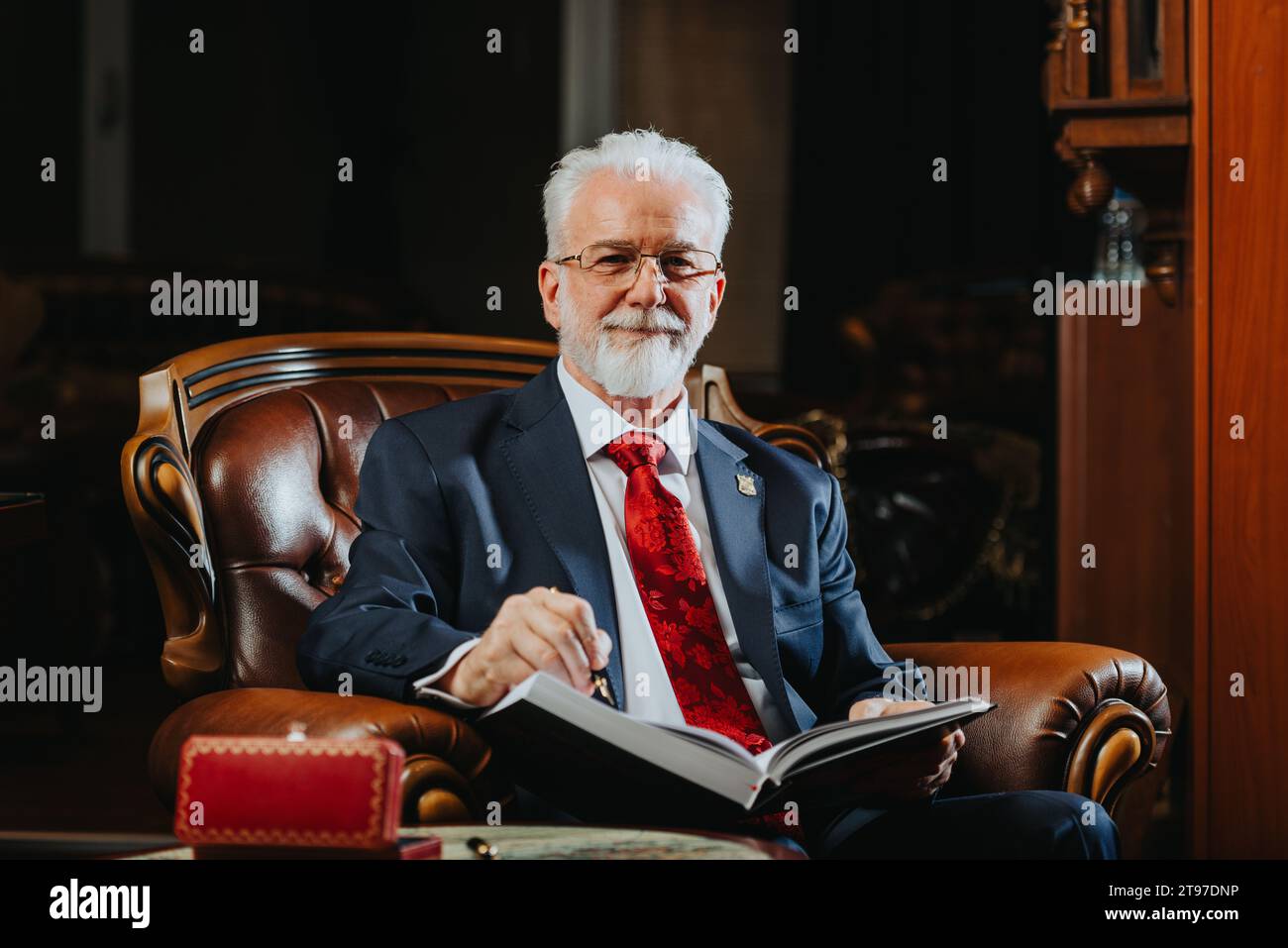 Confident and experienced university rector poses in modern university ...