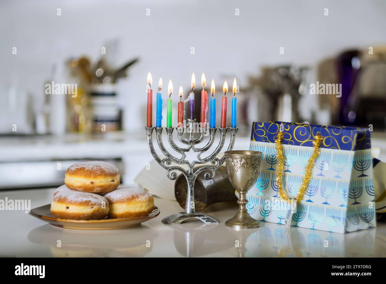 Hanukkiah Menorah candle is lit during traditional celebration of ...