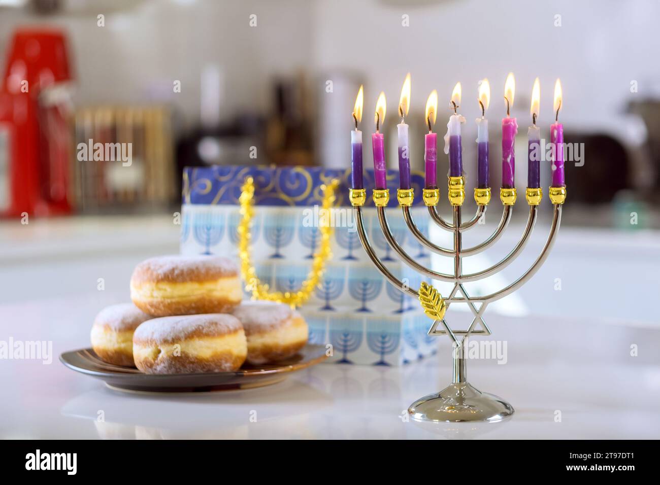 An illuminated Hanukkiah Menorah candles is one symbols of Jewish ...