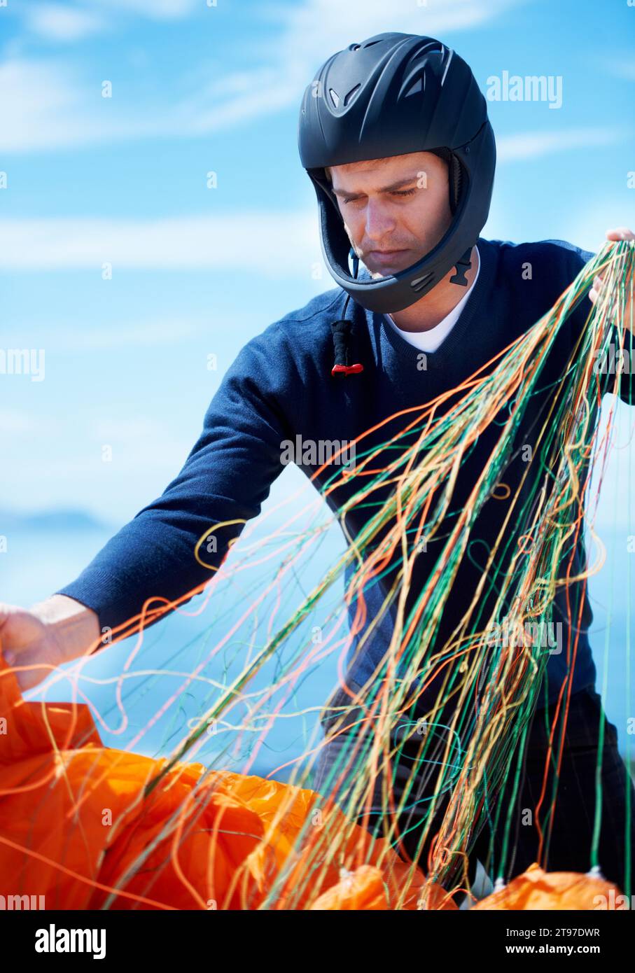 Paragliding, parachute or man with strings in nature in preparation ...