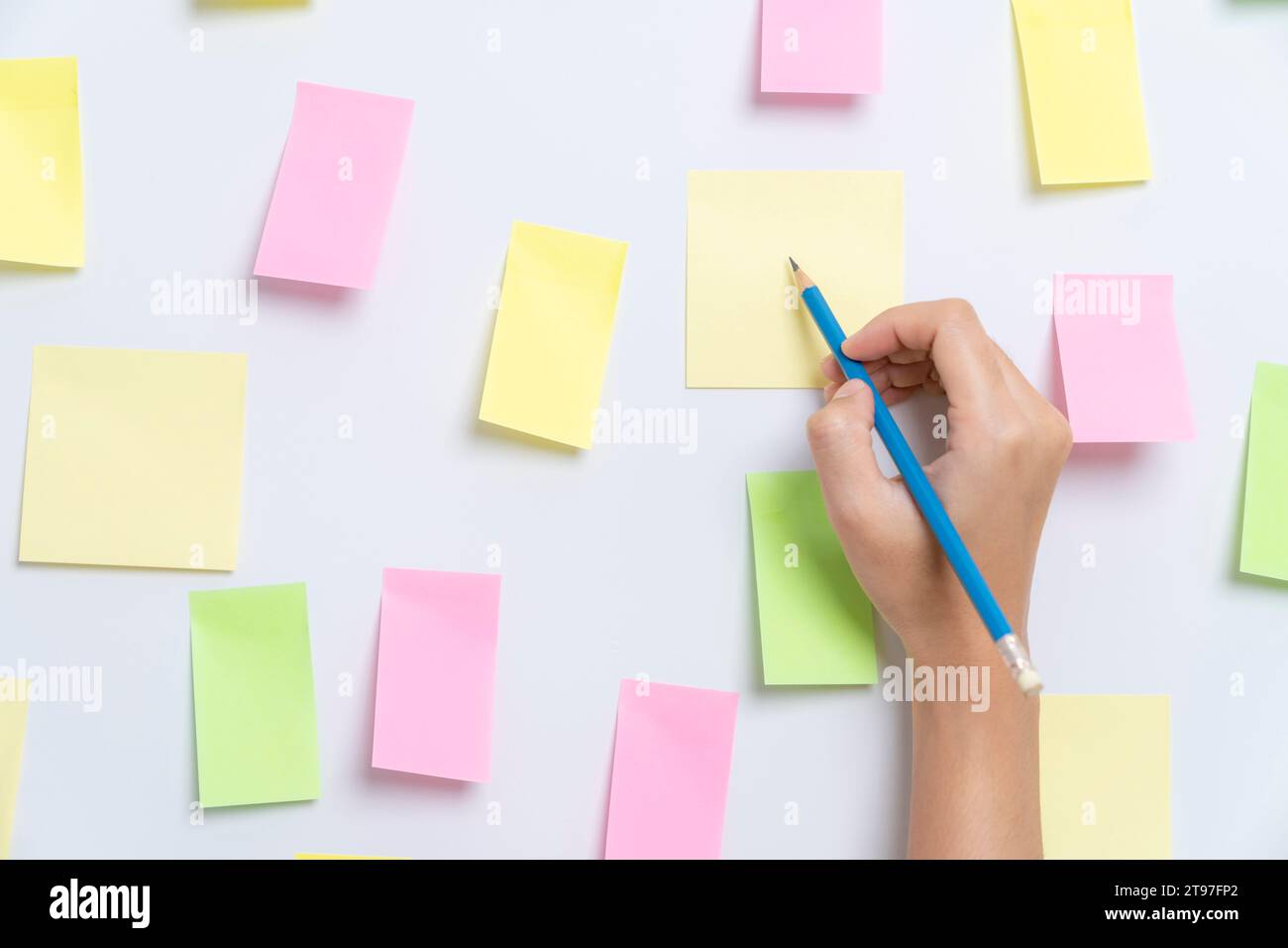 Empty sticky paper note on the wall ready to write wording Stock Photo ...