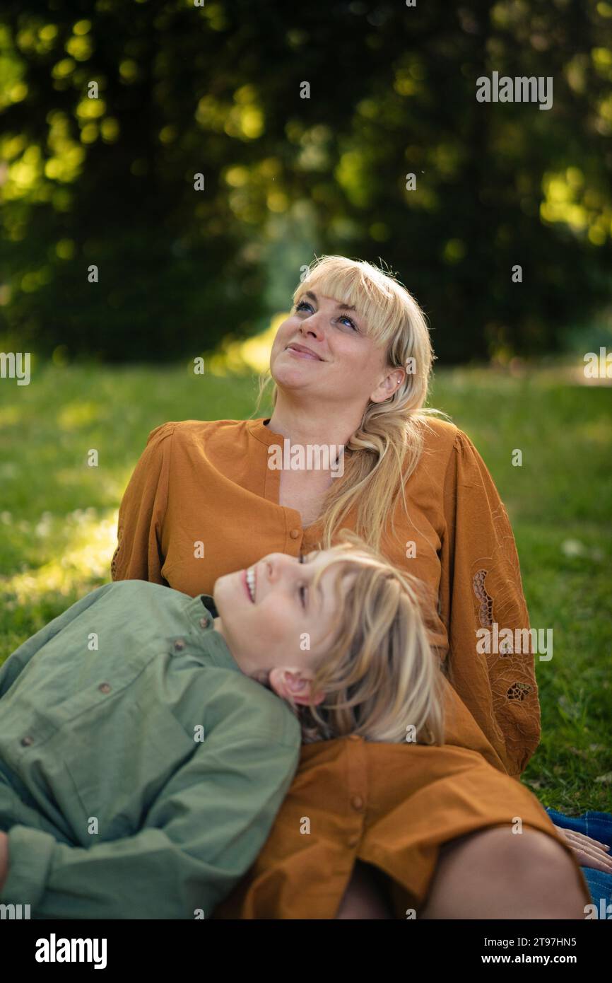 Happy mother and son relaxing in park Stock Photo - Alamy