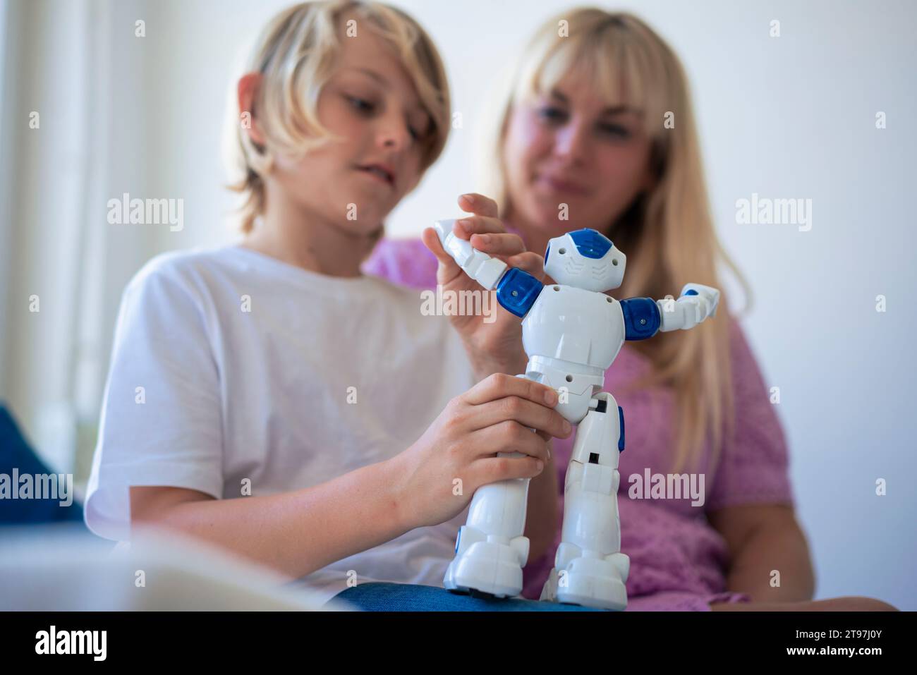 Mother and son playing with robot at home Stock Photo - Alamy