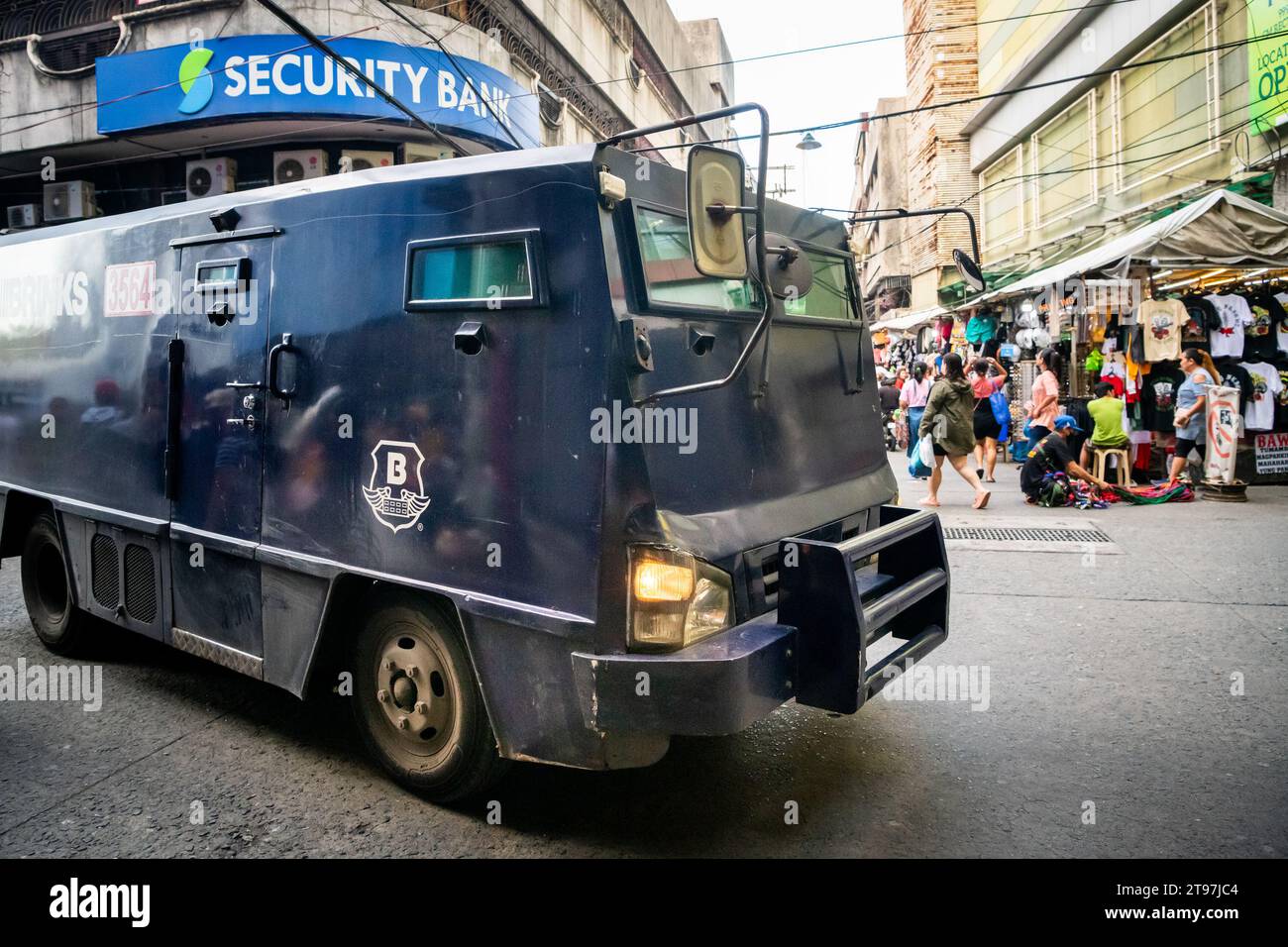 An armoured security bank truck makes a delivery to a bank in Manila ...
