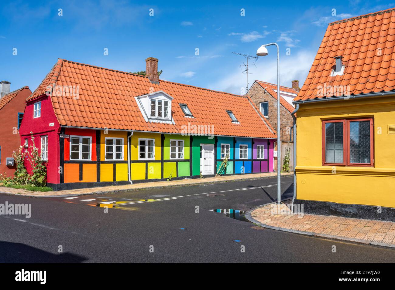 Denmark, Bornholm, Ronne, Empty street in front of rainbow-coloured ...