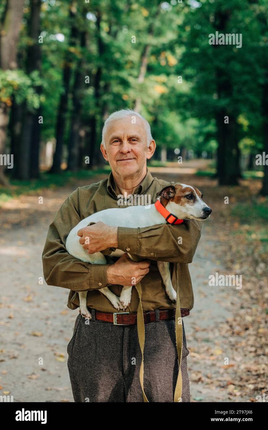 Holding dog in arms hi-res stock photography and images - Alamy