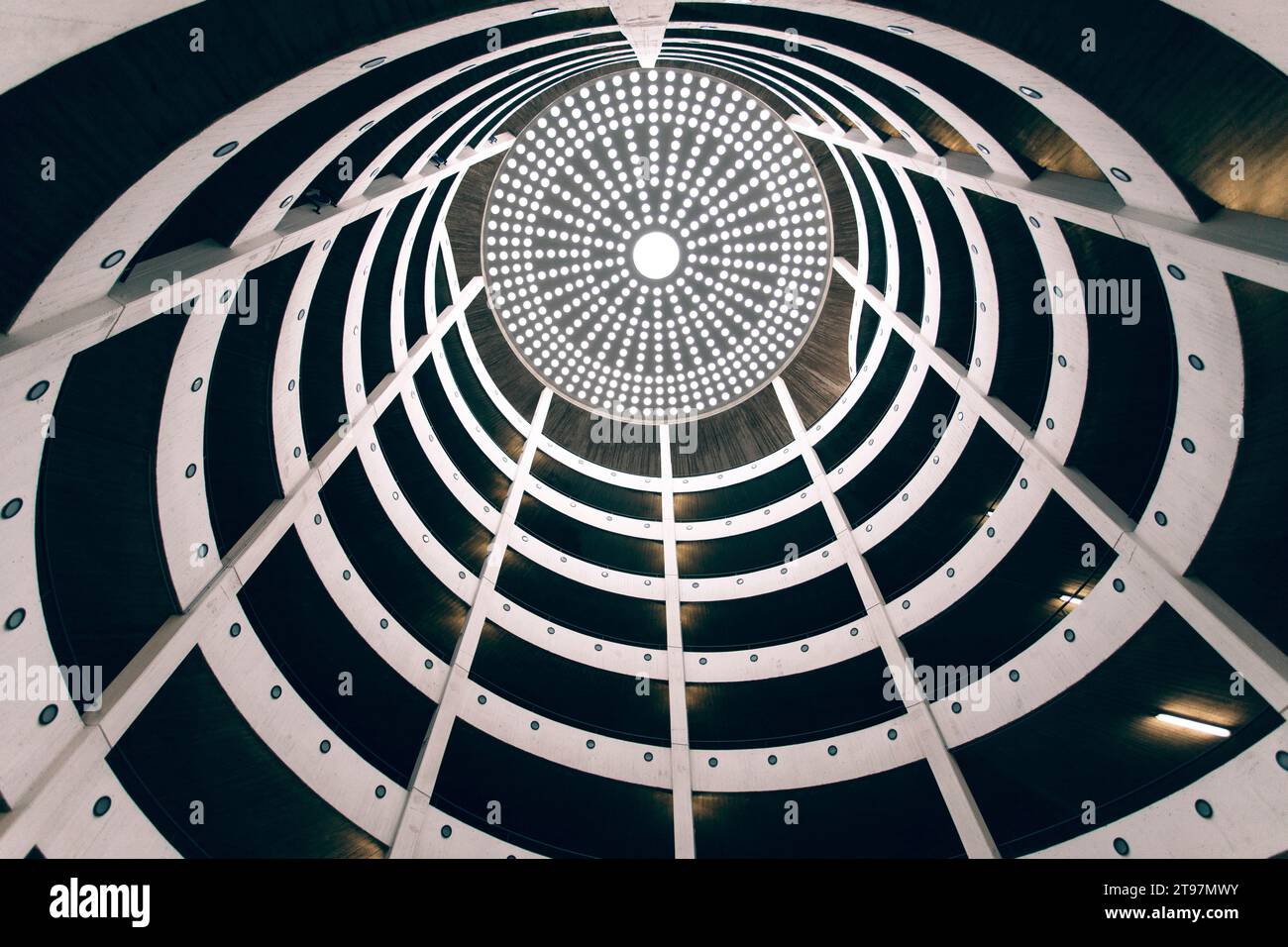 Circular car parking inside building Stock Photo - Alamy