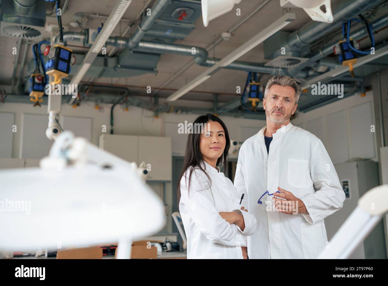 Smiling scientists standing together in laboratory Stock Photo - Alamy