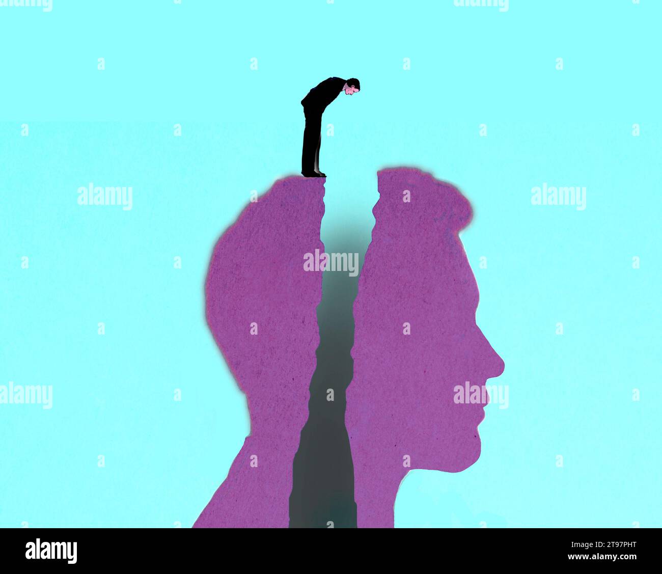Man standing on top of large split head Stock Photo - Alamy