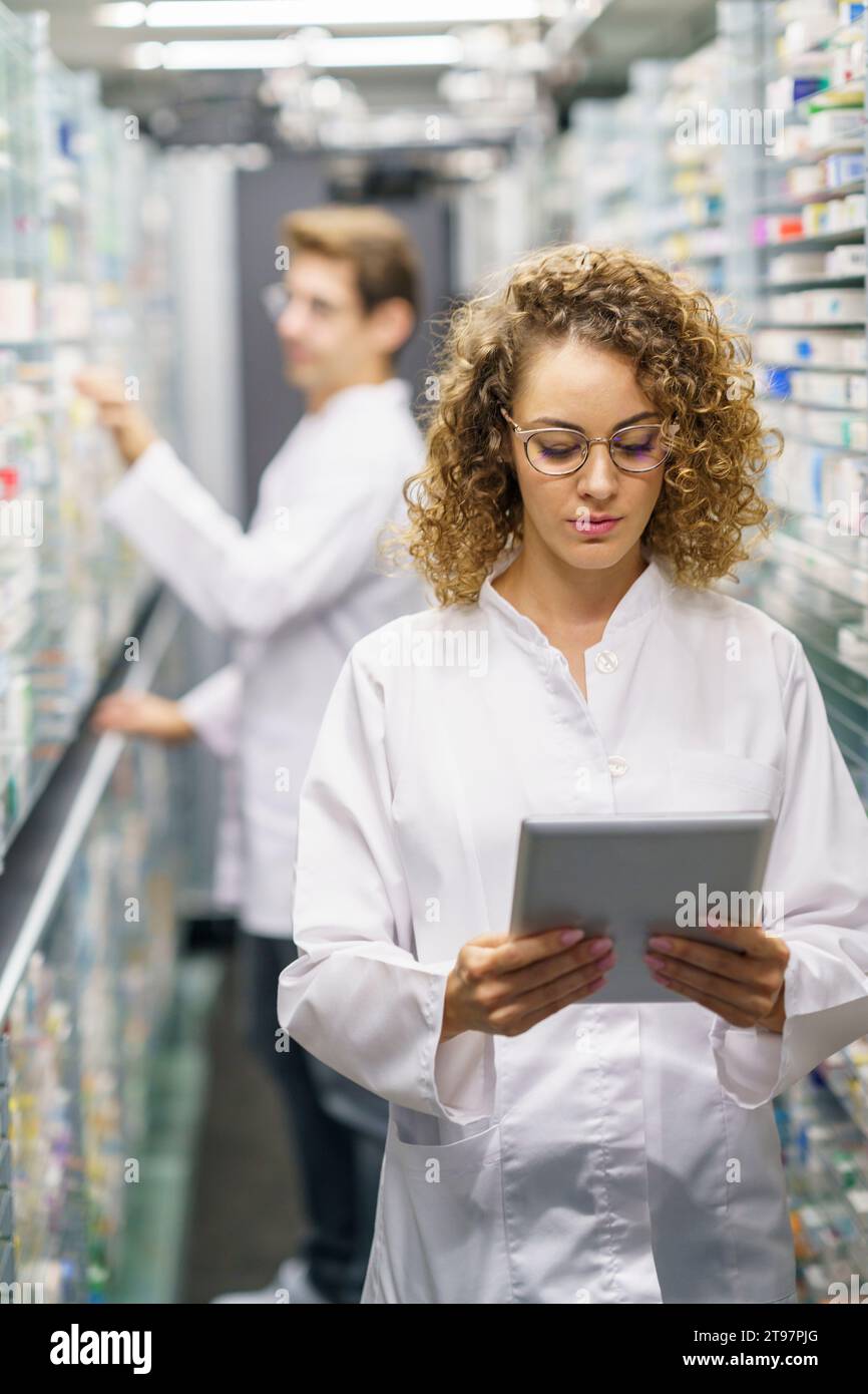Female pharmacist taking inventory hi-res stock photography and images ...
