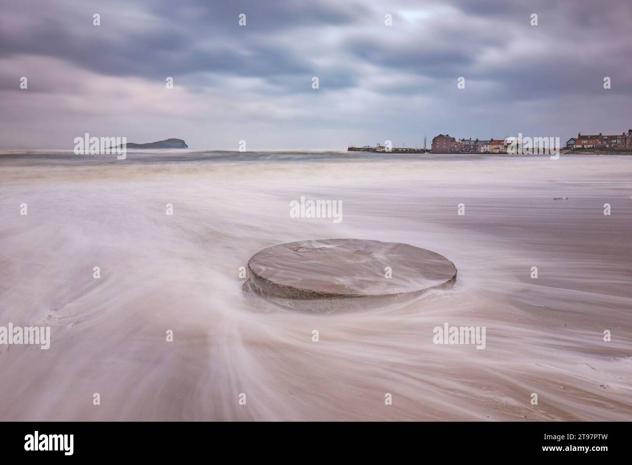 UK, Scotland, North Berwick, Long exposure of waves crashing onto beach ...