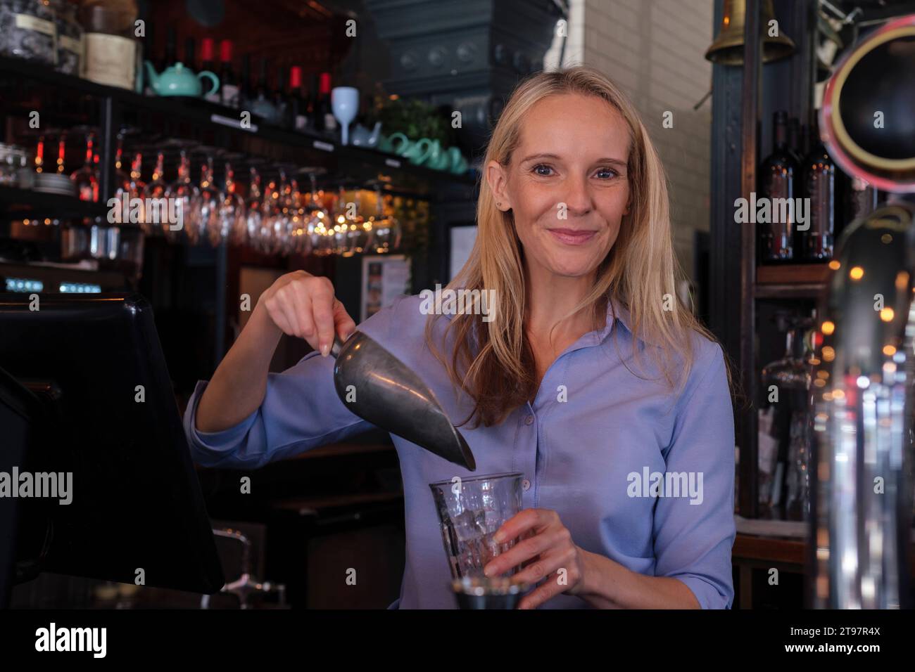 Portrait happy bartender in bar hi-res stock photography and images - Alamy