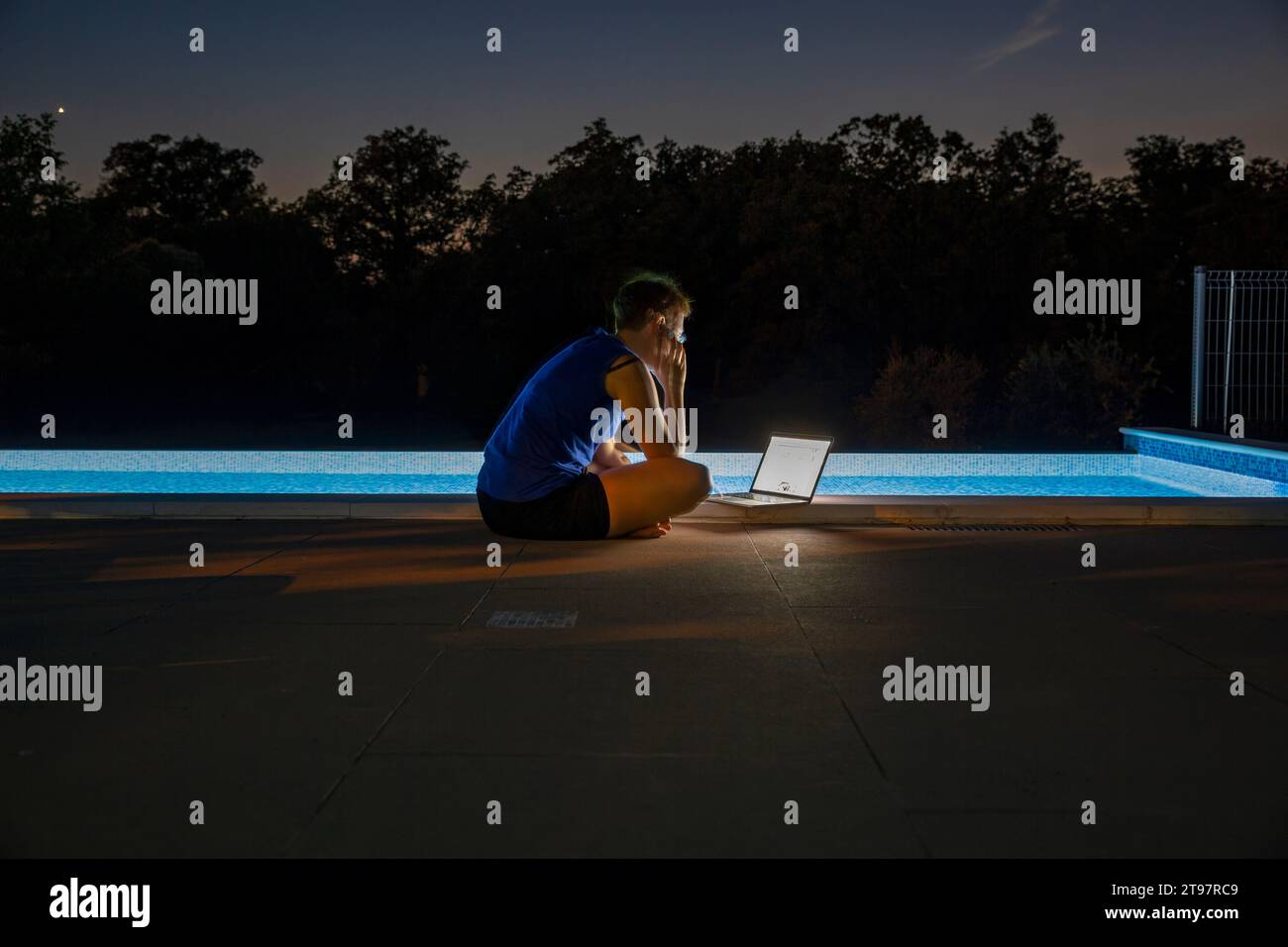 Female freelancer working near pool hi-res stock photography and images ...
