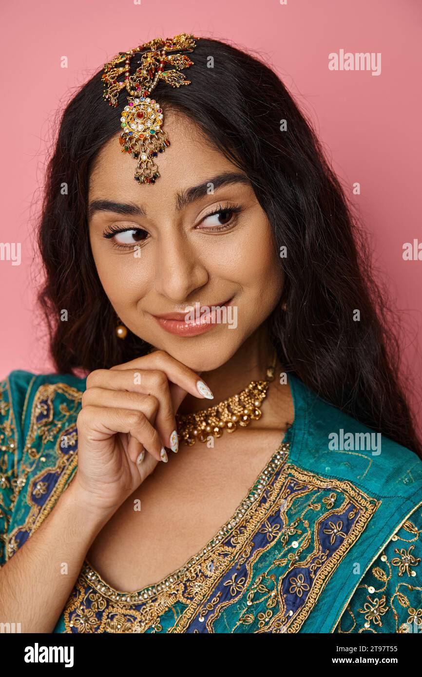 vertical shot of attractive indian woman in blue sari with accessories ...