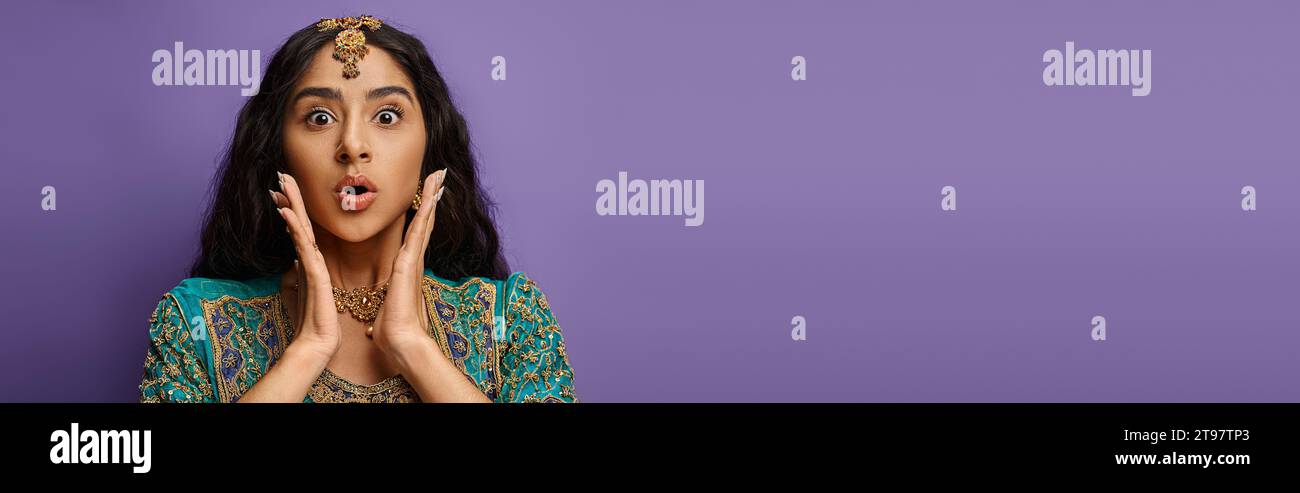 attractive shocked indian woman posing with hands near face looking at ...