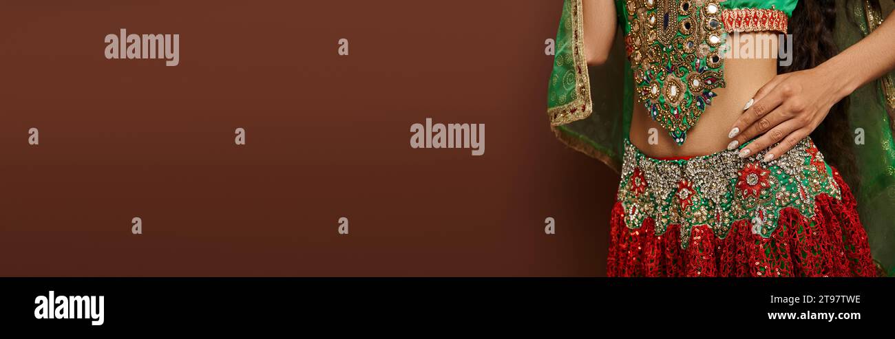 cropped view of belly of young indian woman in traditional costume on ...