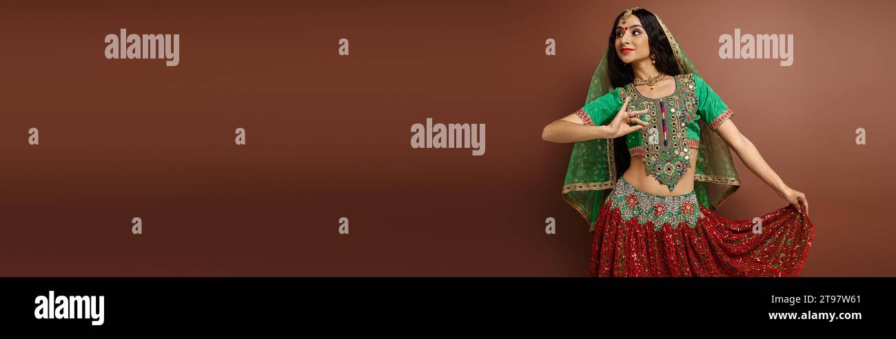 beautiful indian woman with bindi dot in traditional attire gesturing ...