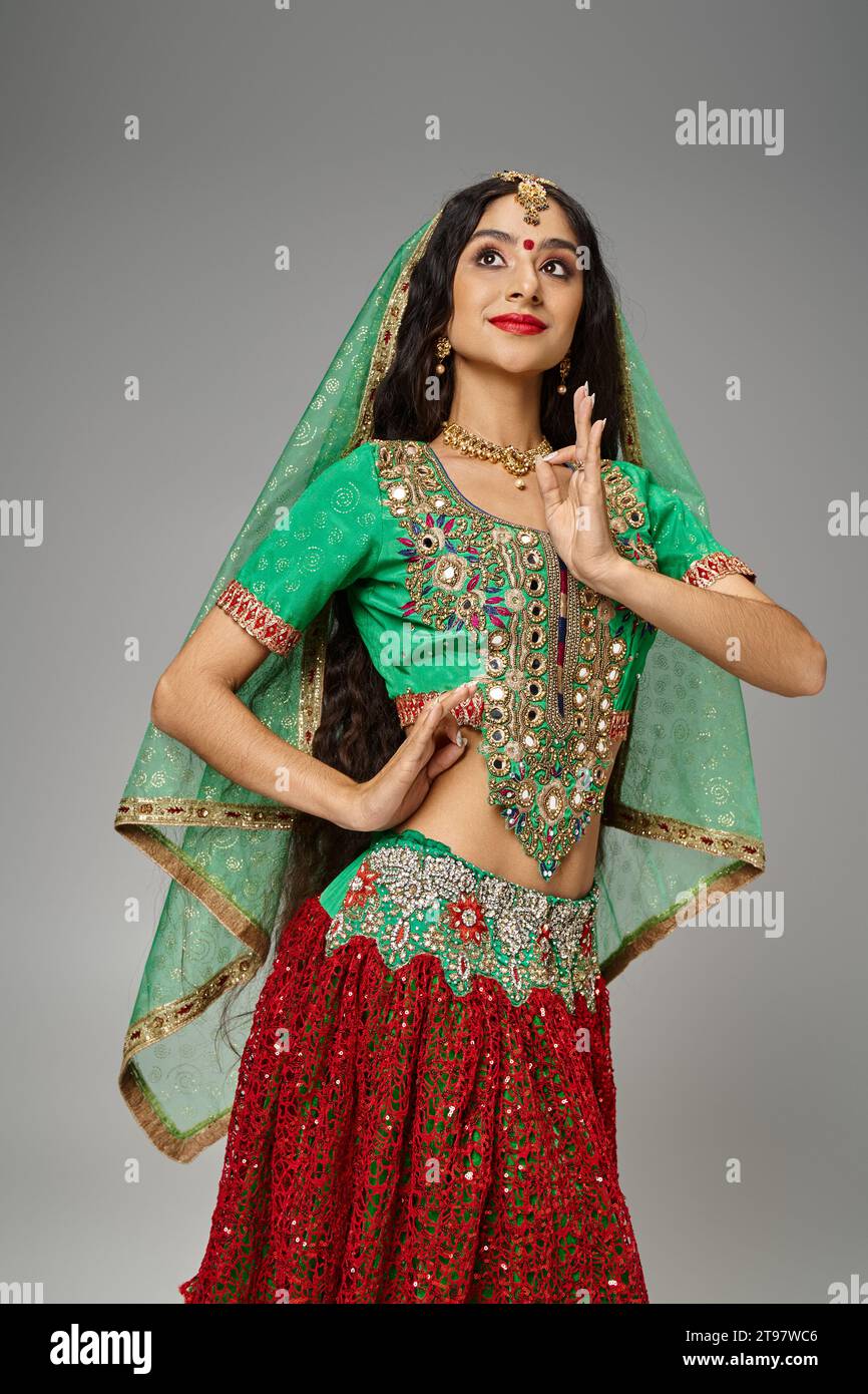vertical shot of beautiful long haired indian woman with bindi dot ...