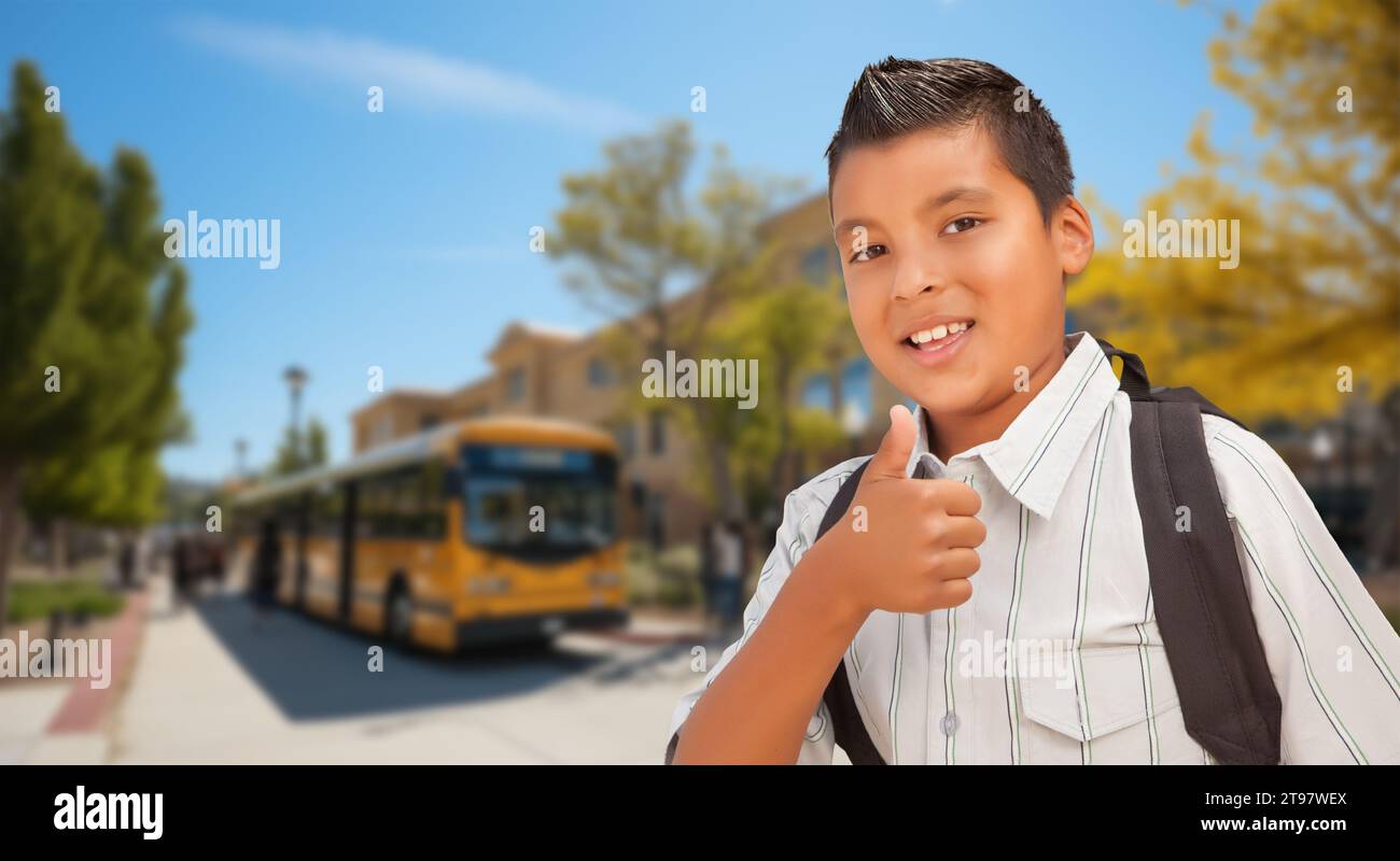 Excited Young Hispanic Boy Wearing a Backpack Giving Two Thumbs Up on ...