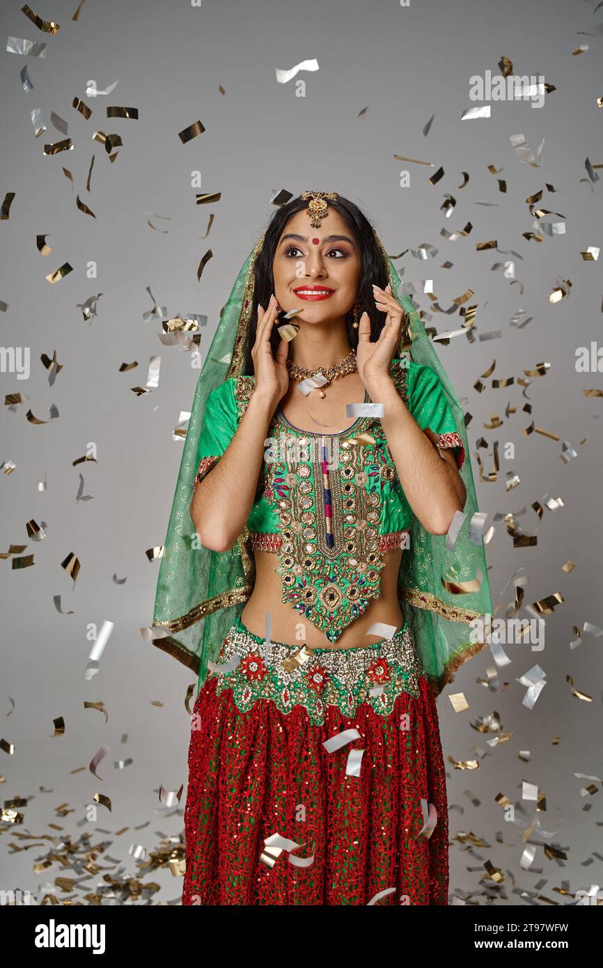 vertical shot of young beautiful indian woman in national costume with ...