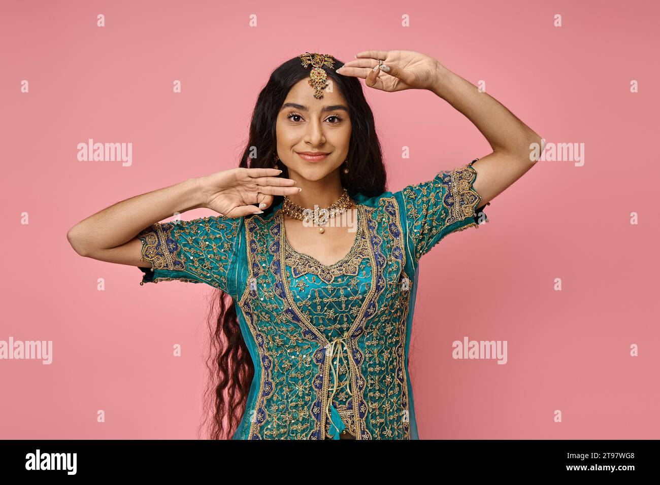 attractive young indian female model in national costume gesturing ...
