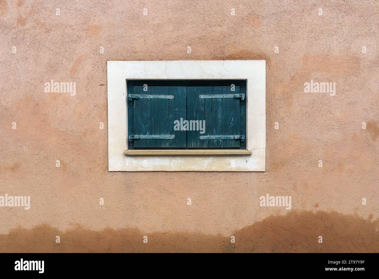 Wooden antique small window shutters on old cement wall Stock Photo - Alamy