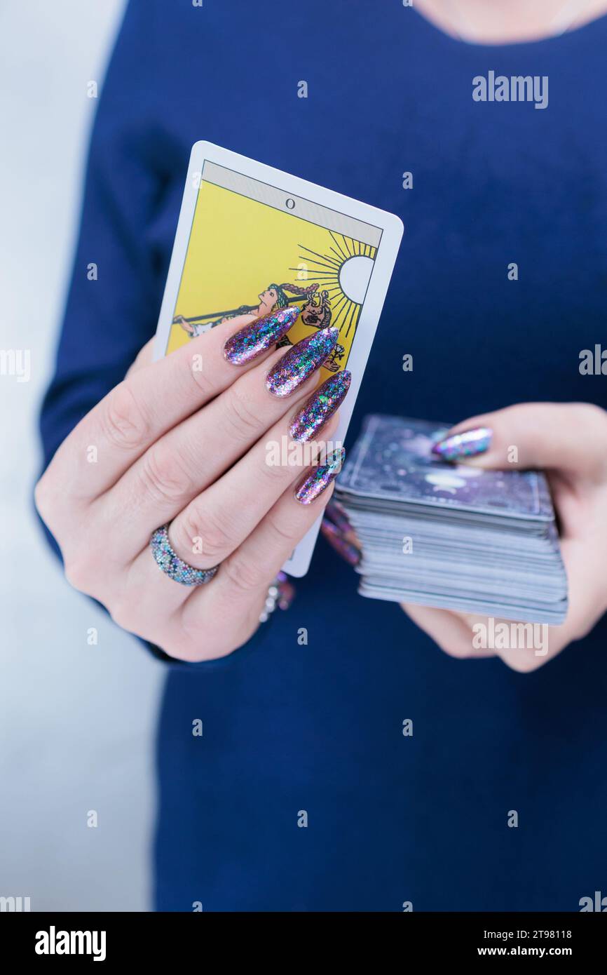 Female hands holding tarot cards for fortune telling and tricks Stock ...
