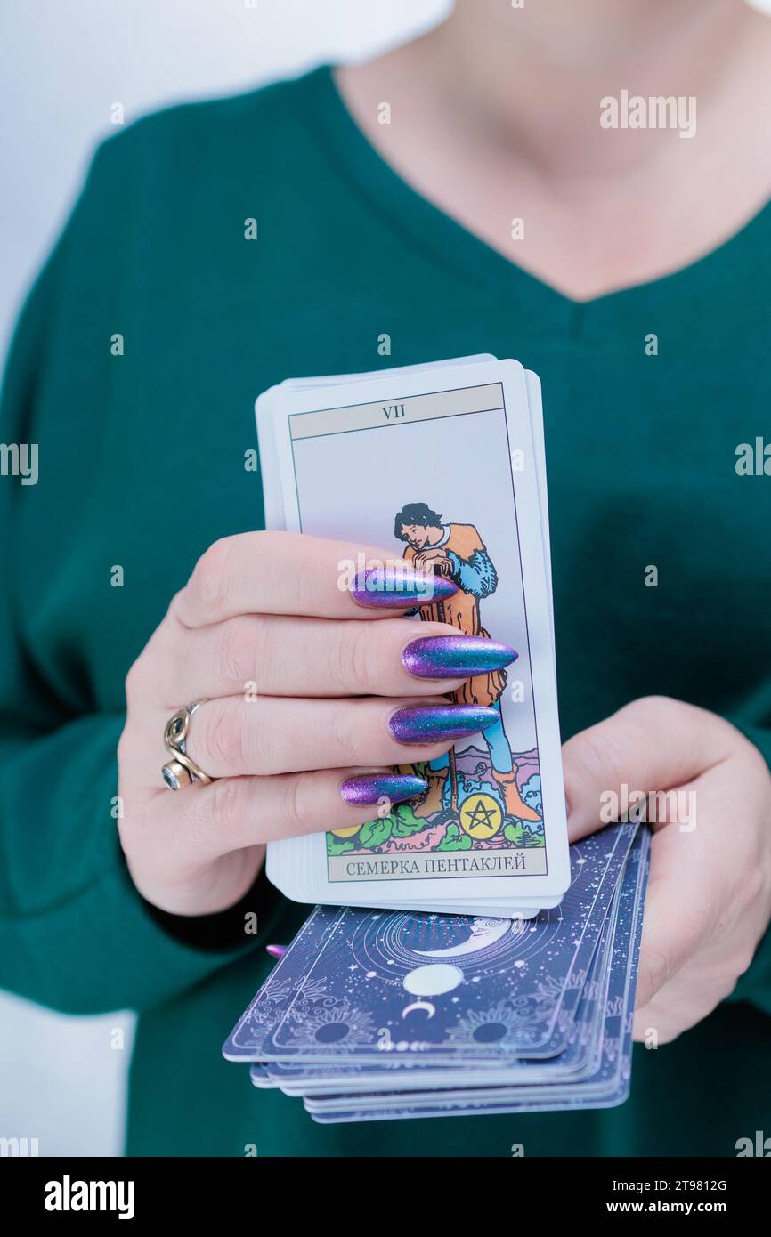 Female hands holding tarot cards for fortune telling and tricks Stock ...