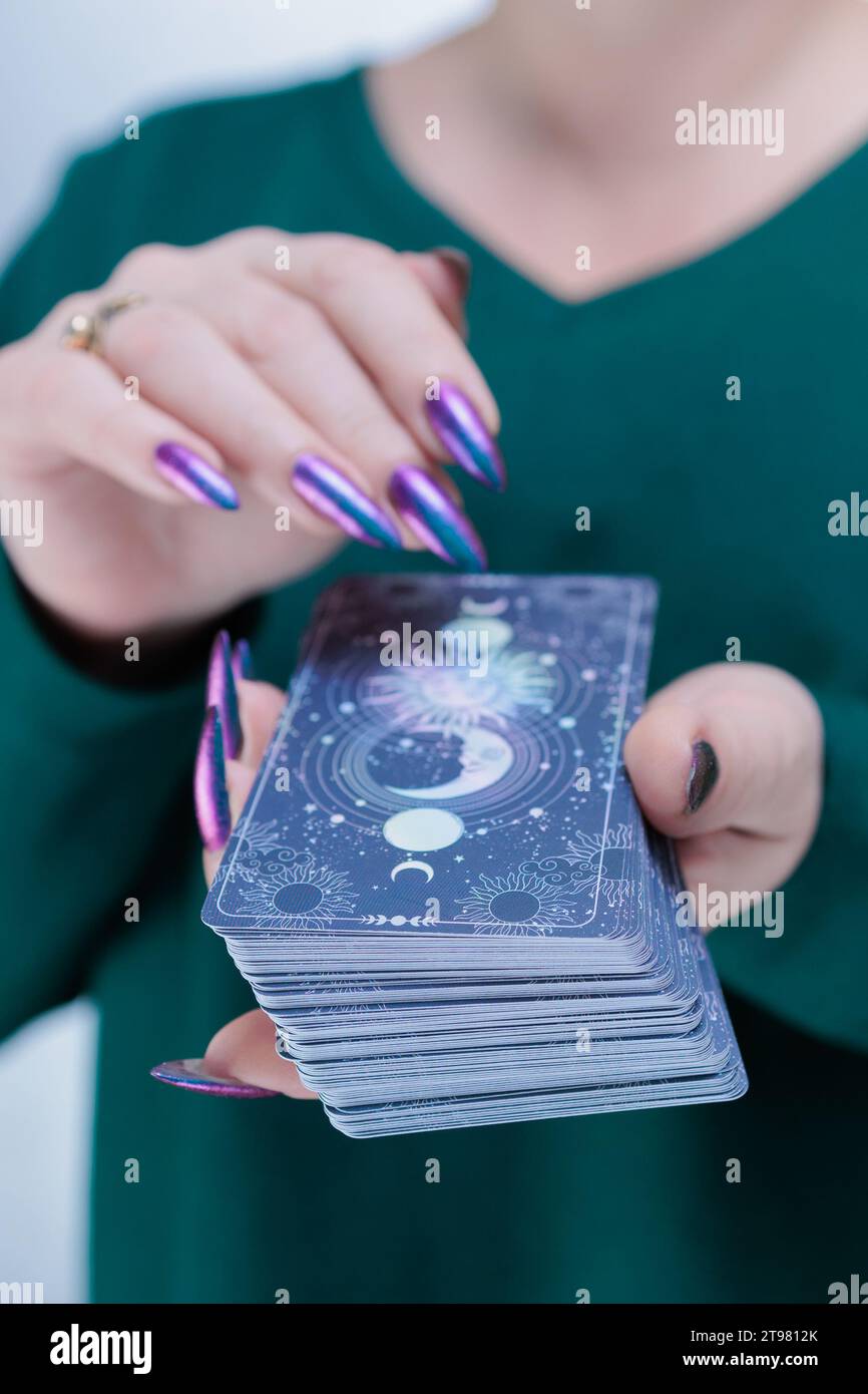 Female hands holding tarot cards for fortune telling and tricks Stock ...