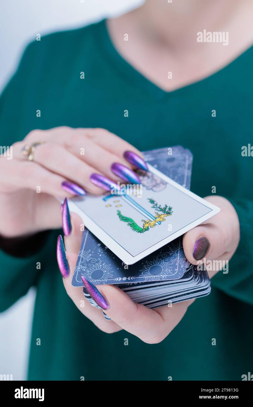 Female hands holding tarot cards for fortune telling and tricks Stock ...