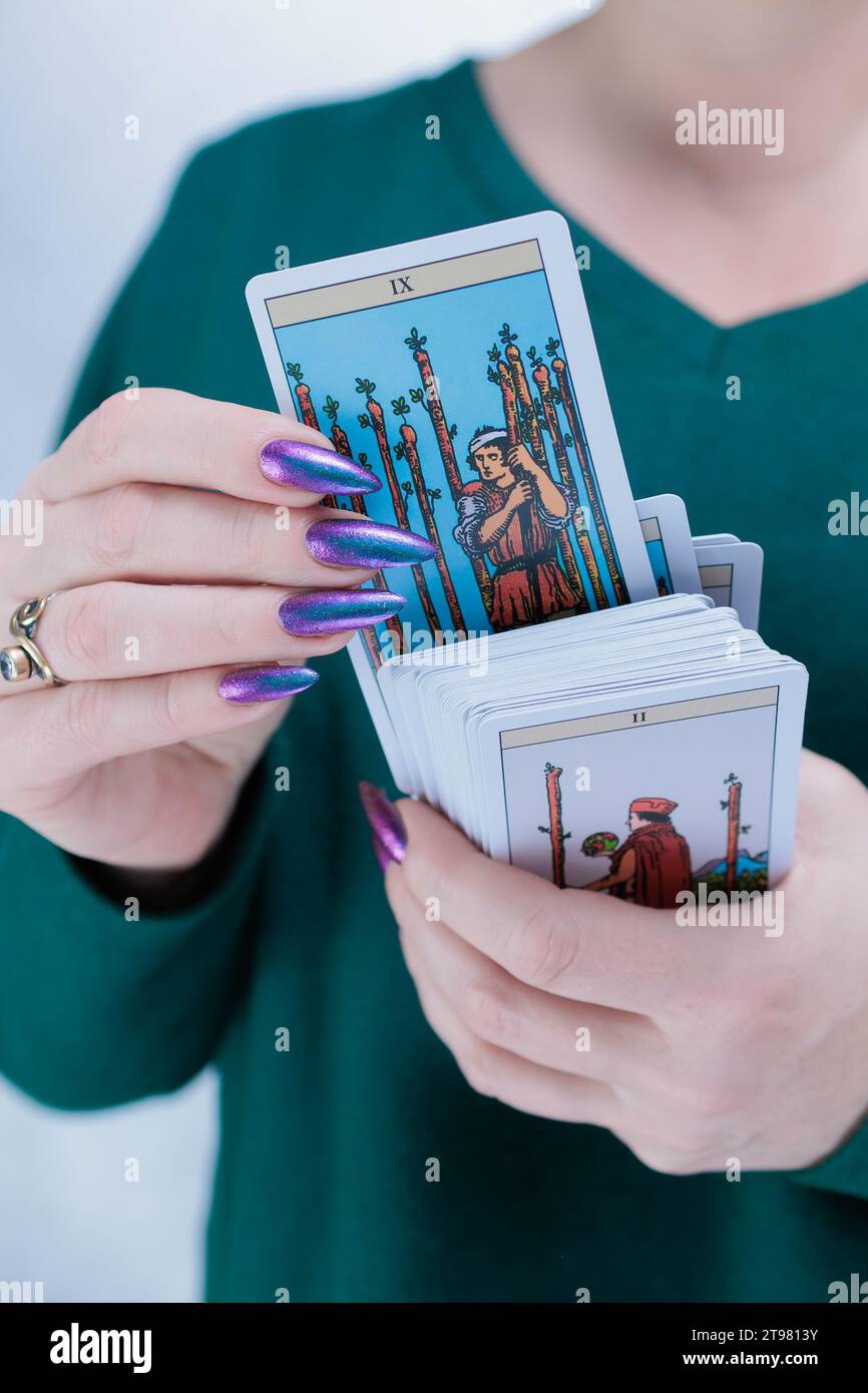 Female hands holding tarot cards for fortune telling and tricks Stock ...