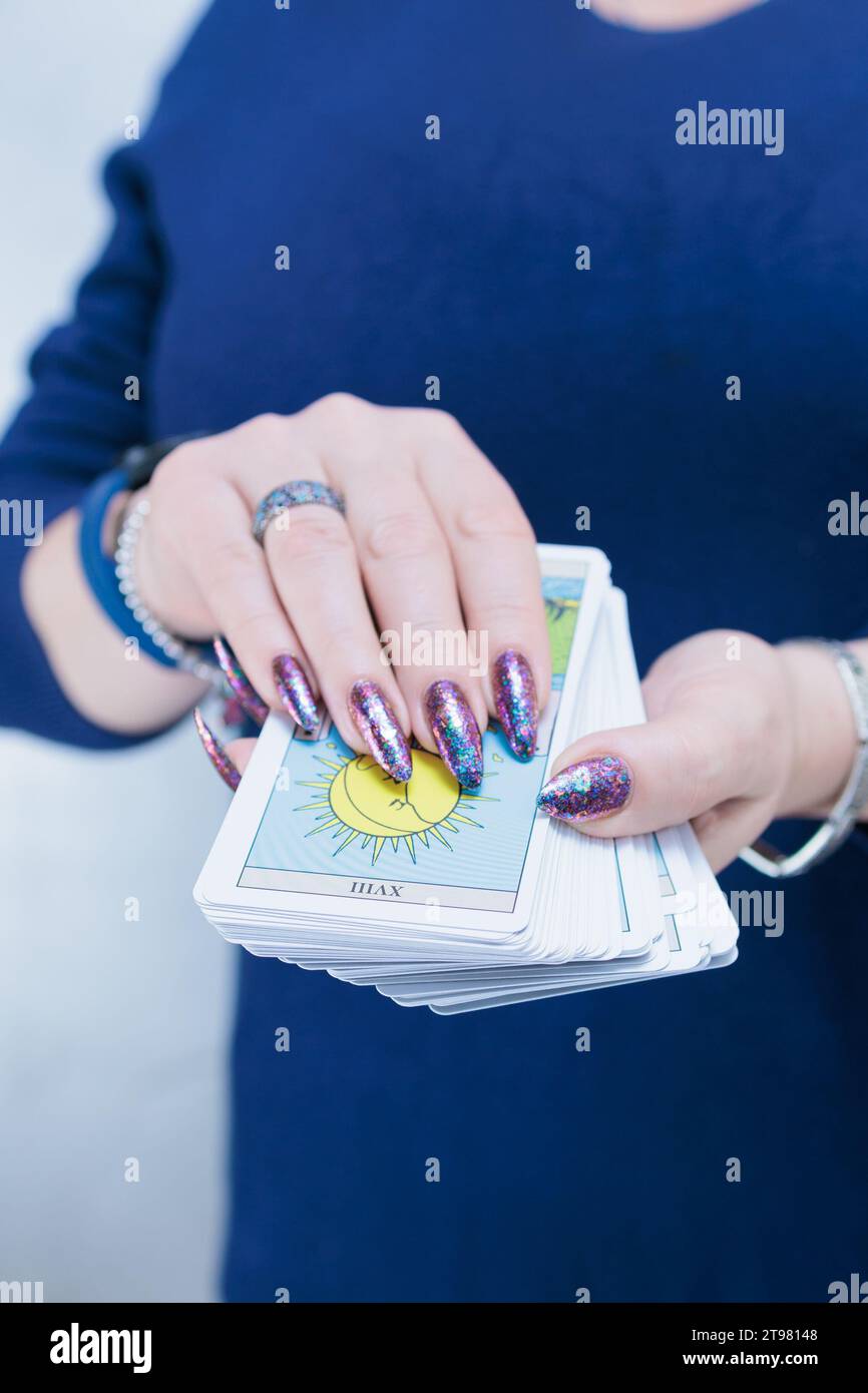 Female hands holding tarot cards for fortune telling and tricks Stock ...