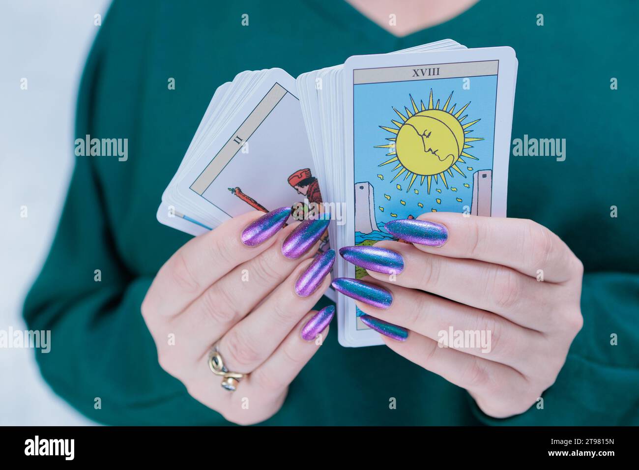 Female hands holding tarot cards for fortune telling and tricks Stock ...